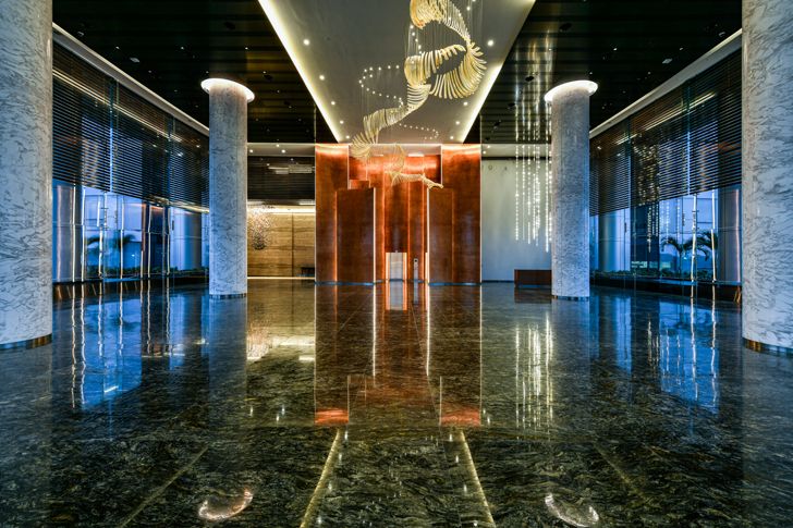 Adani House abuts the Ahmedabad skyline with its aerodynamic form ...